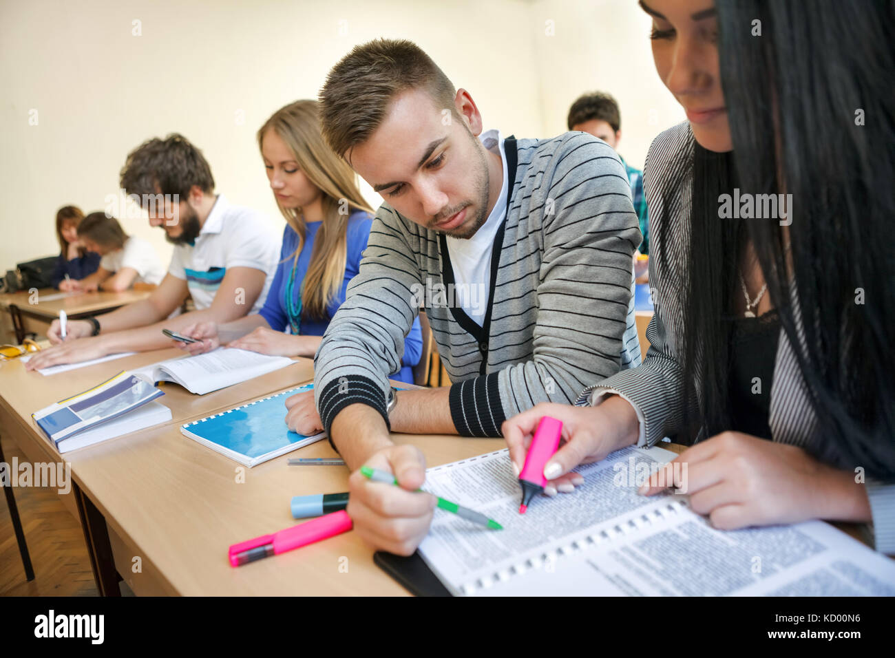 colleagues students on class working together Stock Photo - Alamy