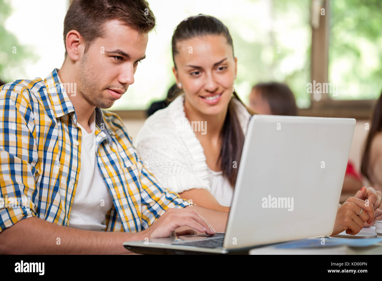 College students with laptop in classroom Stock Photo - Alamy