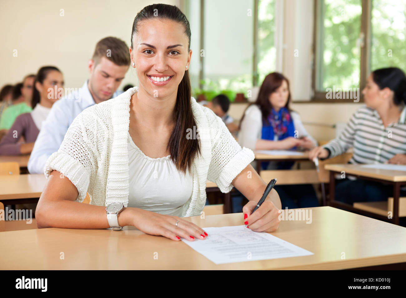 Portrait of female university student in a classroom Stock Photo - Alamy