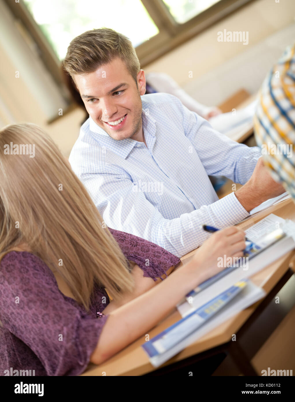 Male college students talking classroom hi-res stock photography and ...