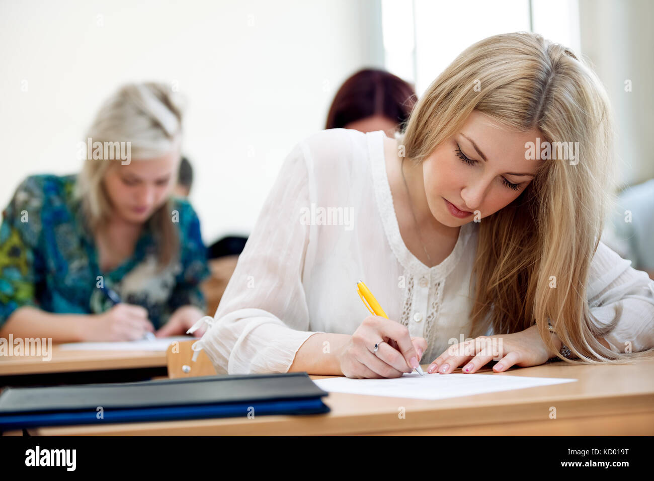 pretty female college student in a classroom Stock Photo - Alamy