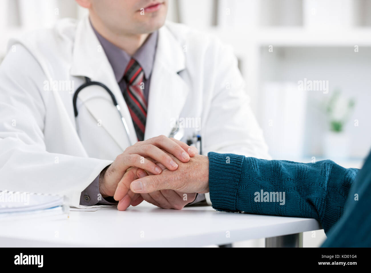 Doctor holding patient's hand, helping hand concept Stock Photo - Alamy