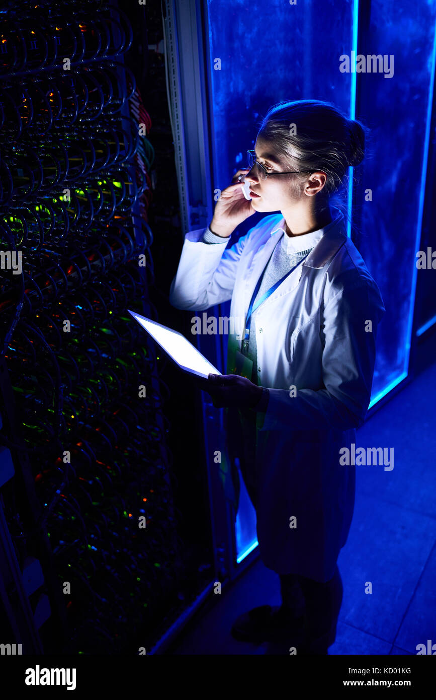High angle portrait of beautiful female scientist working with ...
