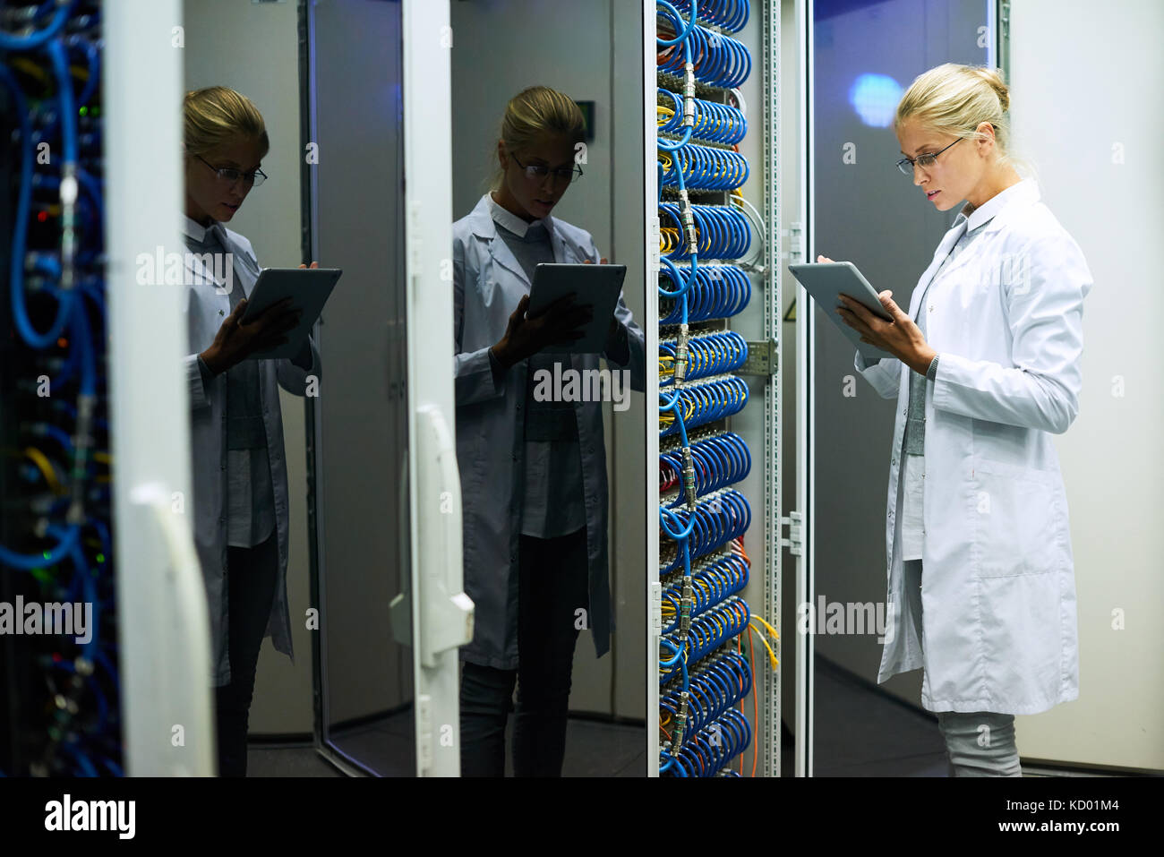Side view portrait of beautiful young woman wearing lab coat working ...
