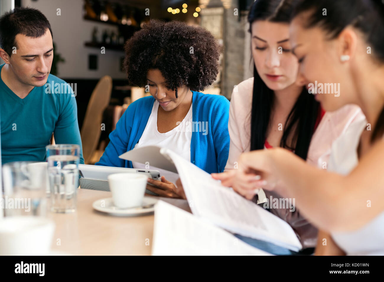 Teenagers study in cafe hi-res stock photography and images - Alamy