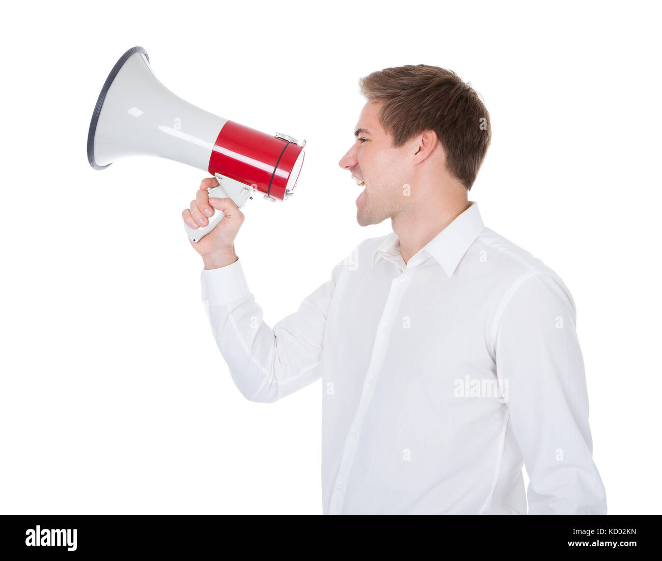 Portrait Of Young Man Shouting Through Megaphone Over White Background ...