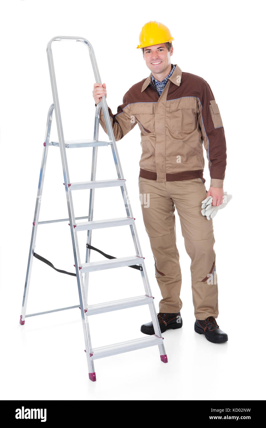 Portrait Of A Happy Mechanic With Ladder Over White Background Stock Photo - Alamy