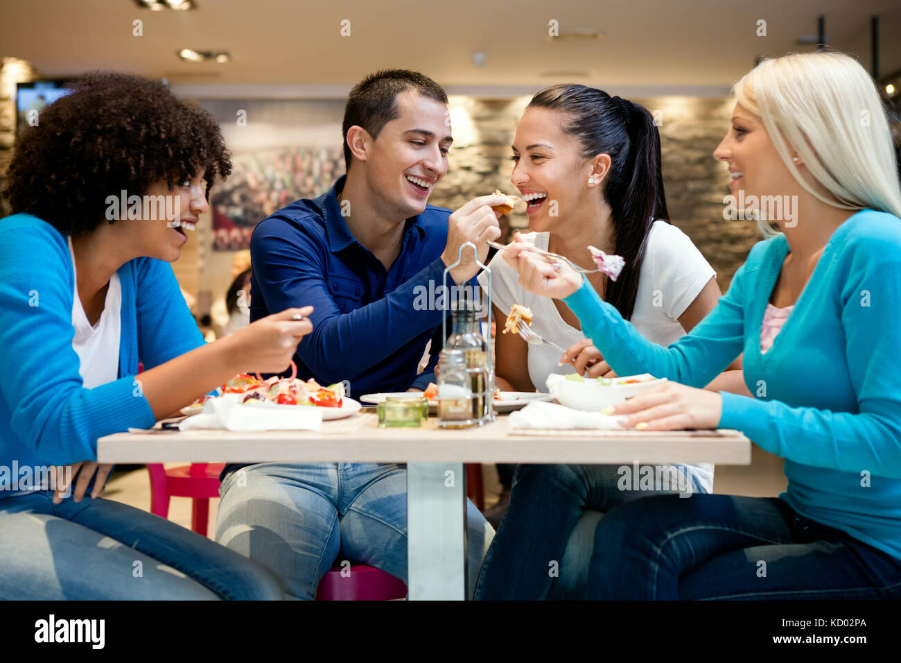Happiness teenagers enjoying in lunch at restaurant Stock Photo - Alamy