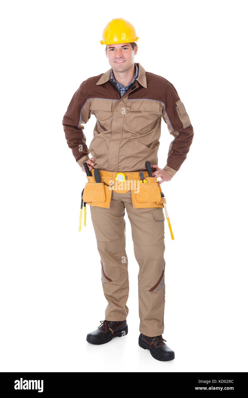 Portrait Of A Mechanic With Hand On Hip Standing On White Background ...