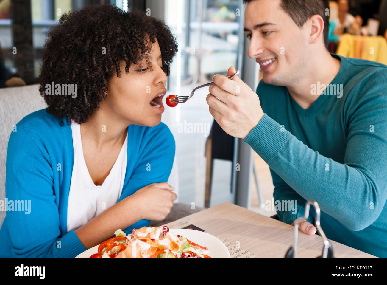 Affectionate couple having lunch, launch time Stock Photo - Alamy