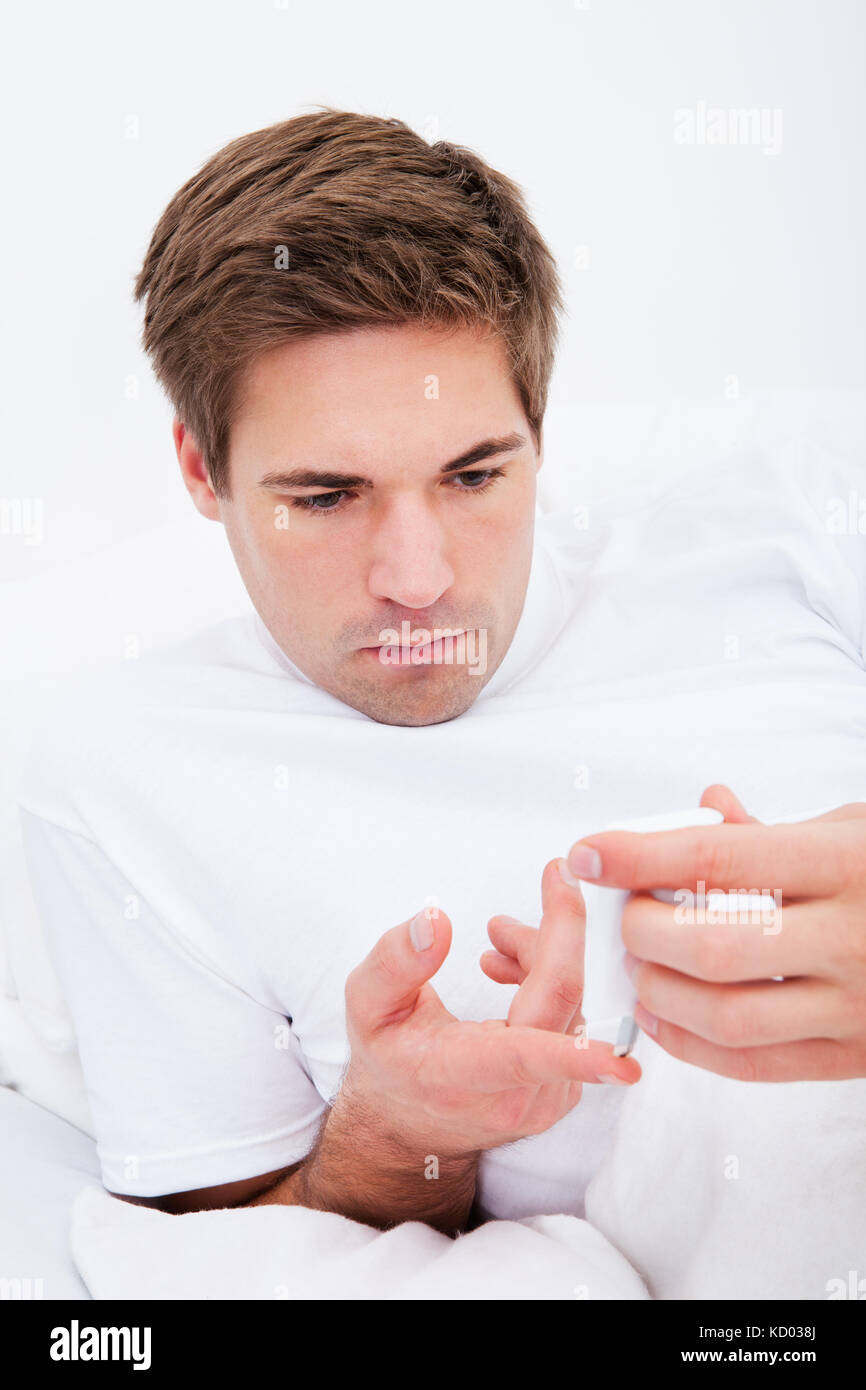 Young Man Examining Blood Sugar Level Of His Own Stock Photo - Alamy