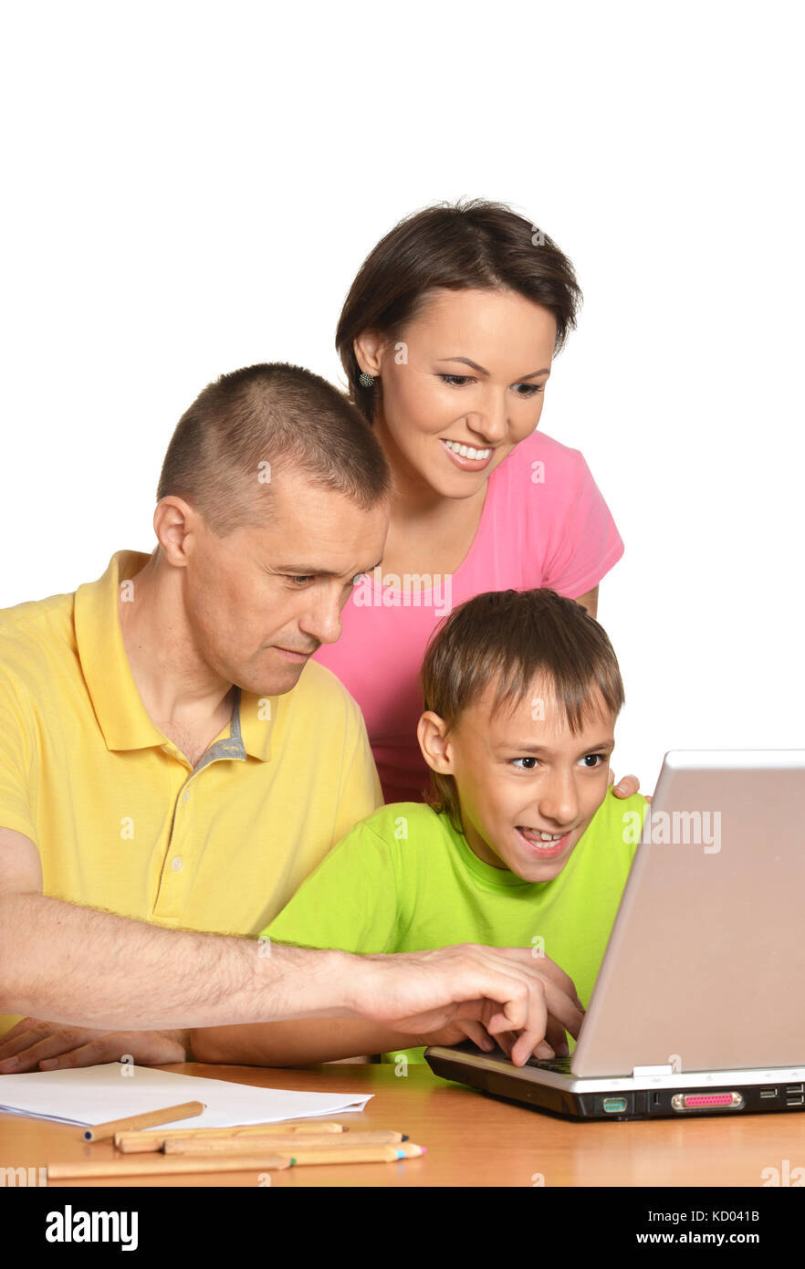 Parents and son using modern laptop Stock Photo - Alamy