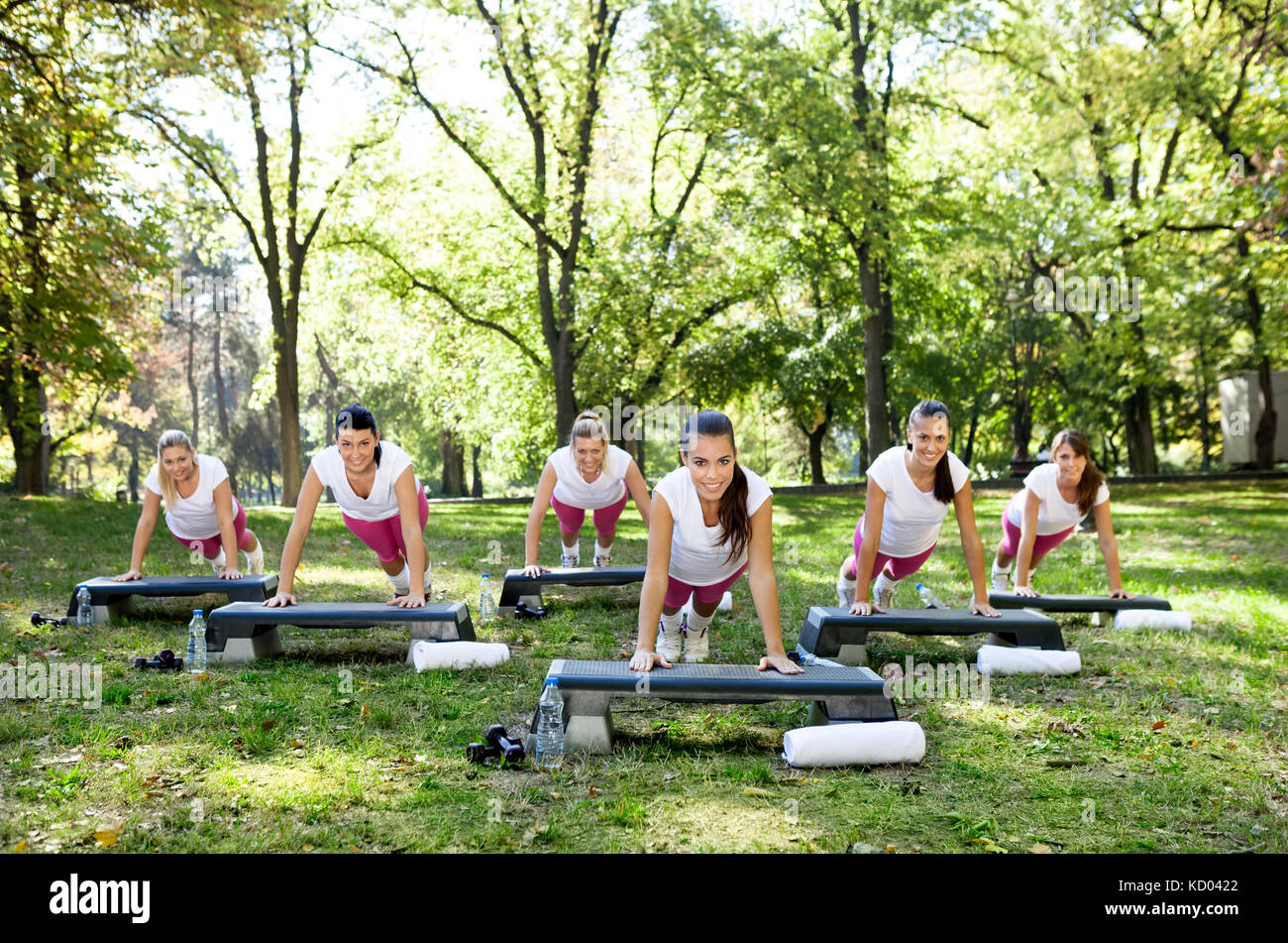 Group of exercise women doing push-ups, outdoor Stock Photo - Alamy