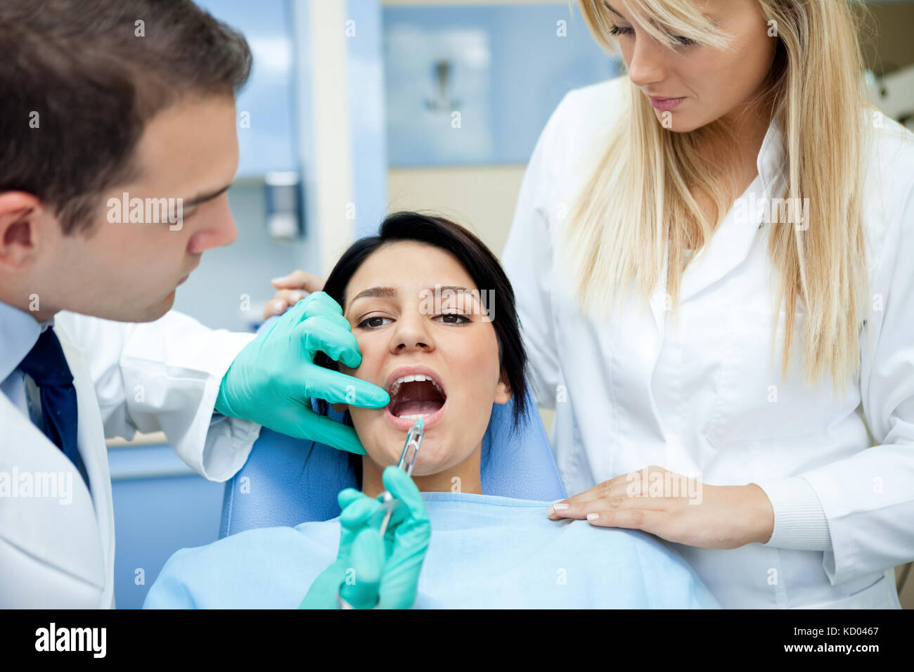 Dentist giving anesthesia his patient Stock Photo - Alamy