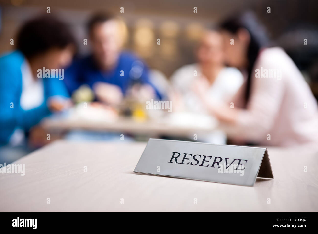 reserved table at nice restaurant with guests in the background Stock ...