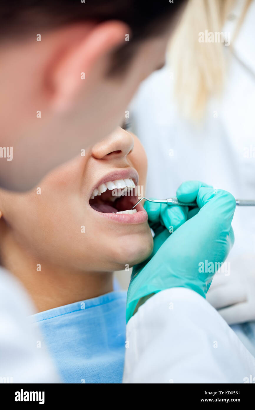 dentist checking patient's teeth - concept dental care Stock Photo - Alamy