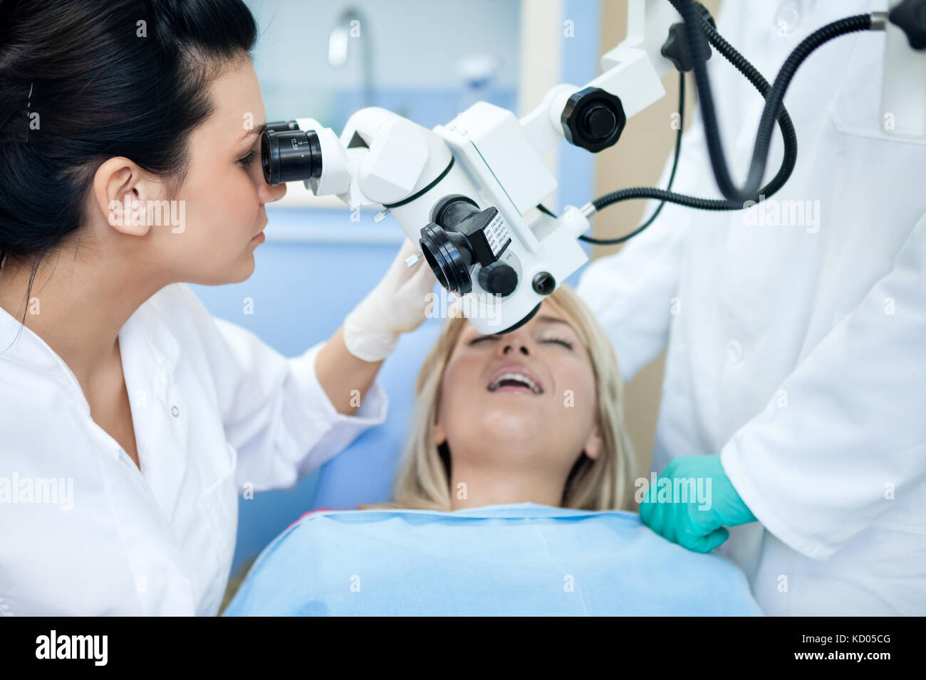 professional dentist examination patient with microscope at the office ...