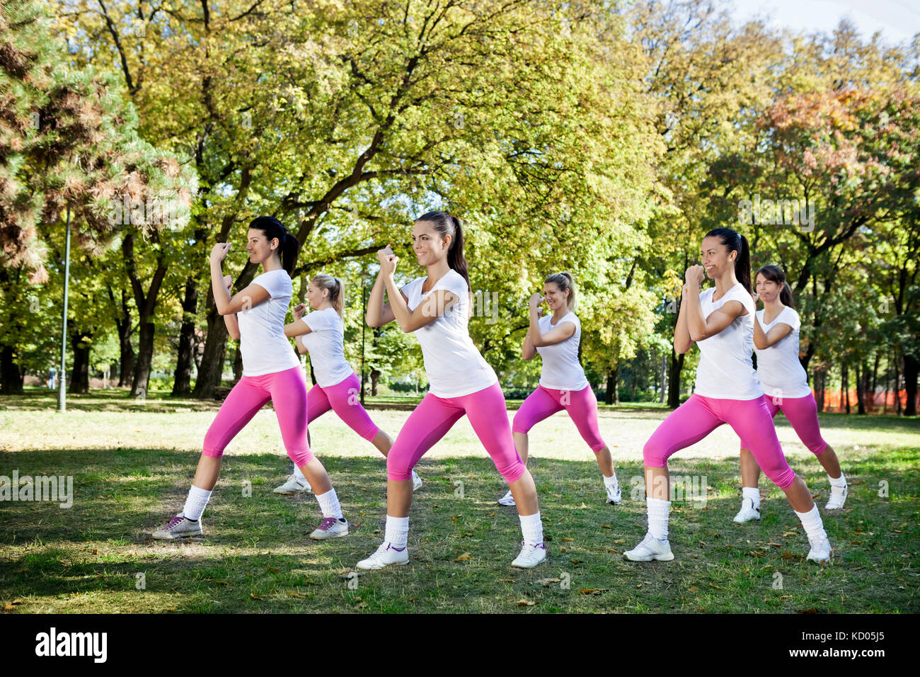Six young women doing exercising, outdoor Stock Photo - Alamy