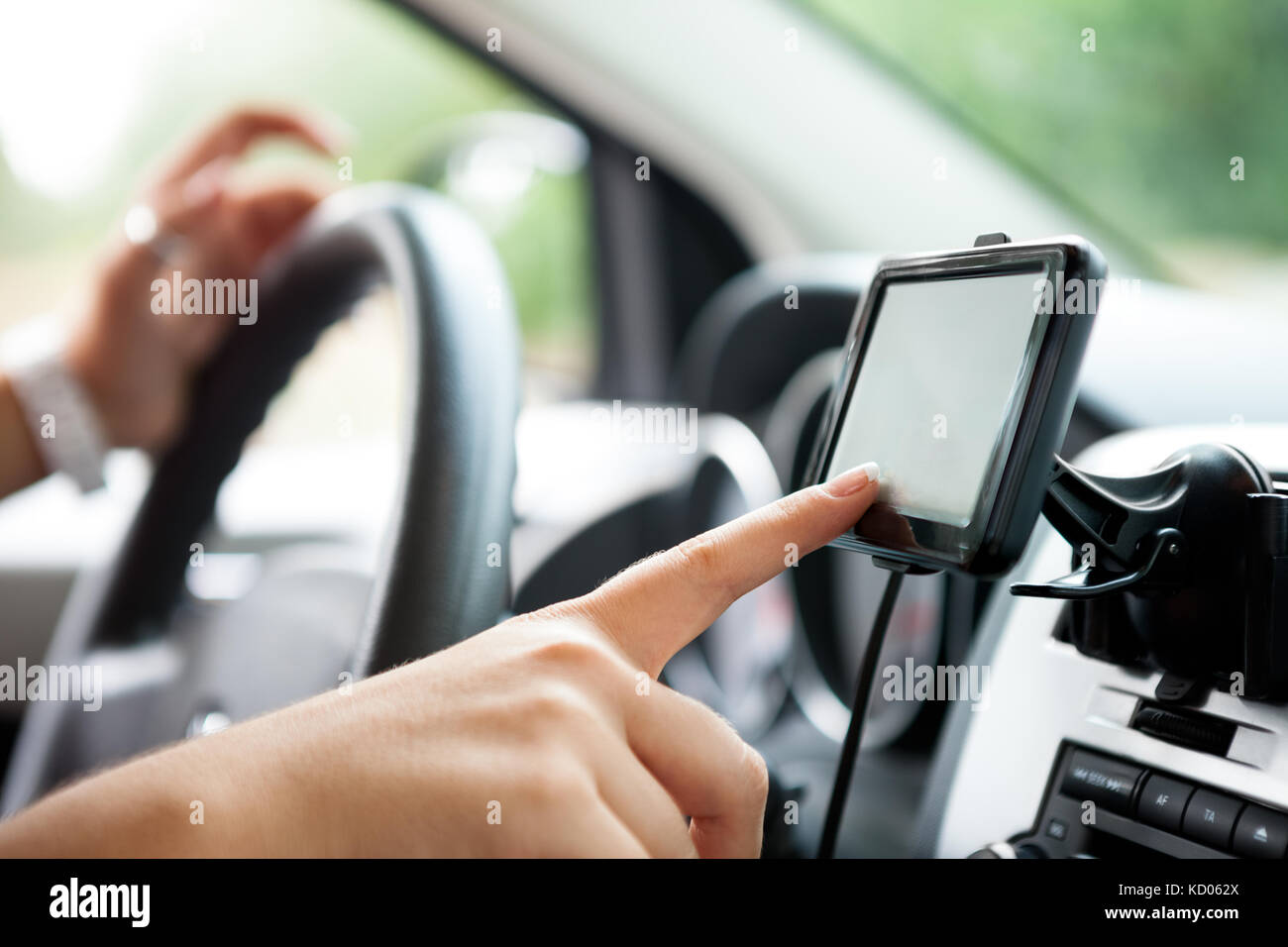 finger pointing and setting at car GPS navigation system Stock Photo ...
