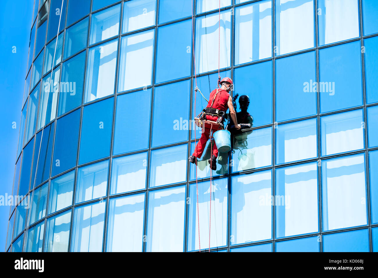Window washer , washing office building windows Stock Photo - Alamy