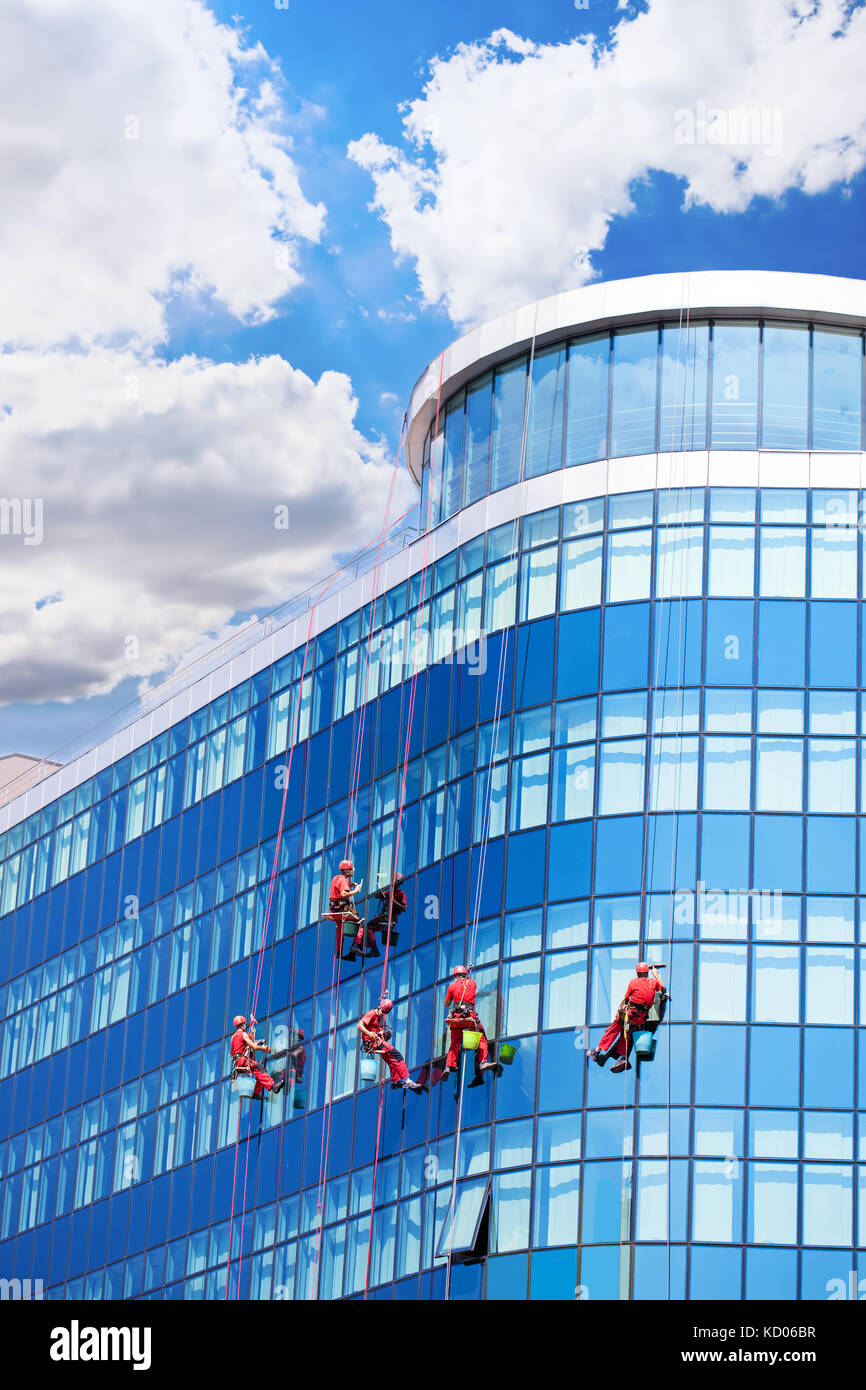 Workers washing windows in the office building Stock Photo - Alamy