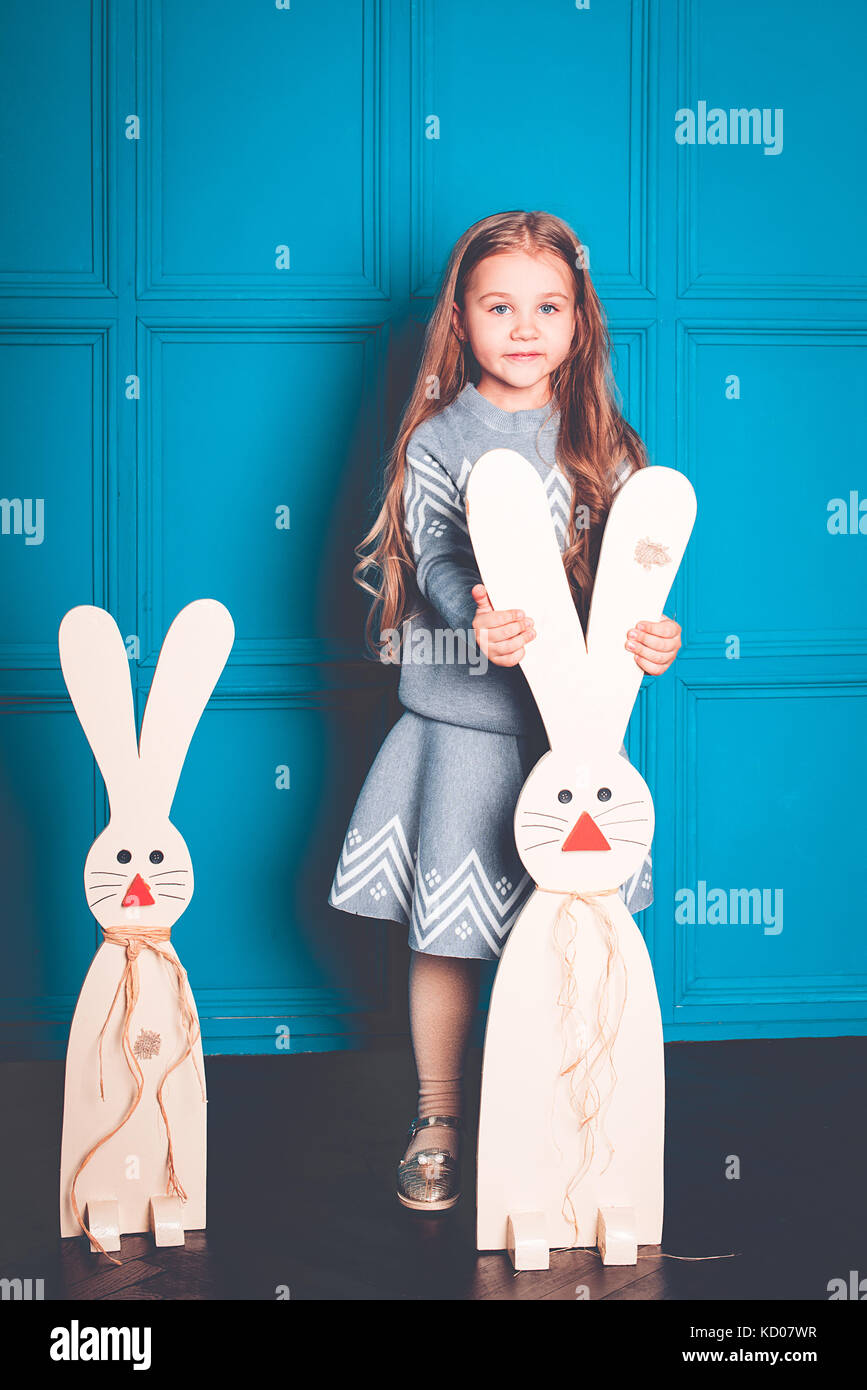 Happy Easter! Cute little child girl with bunnies on Easter day Stock ...