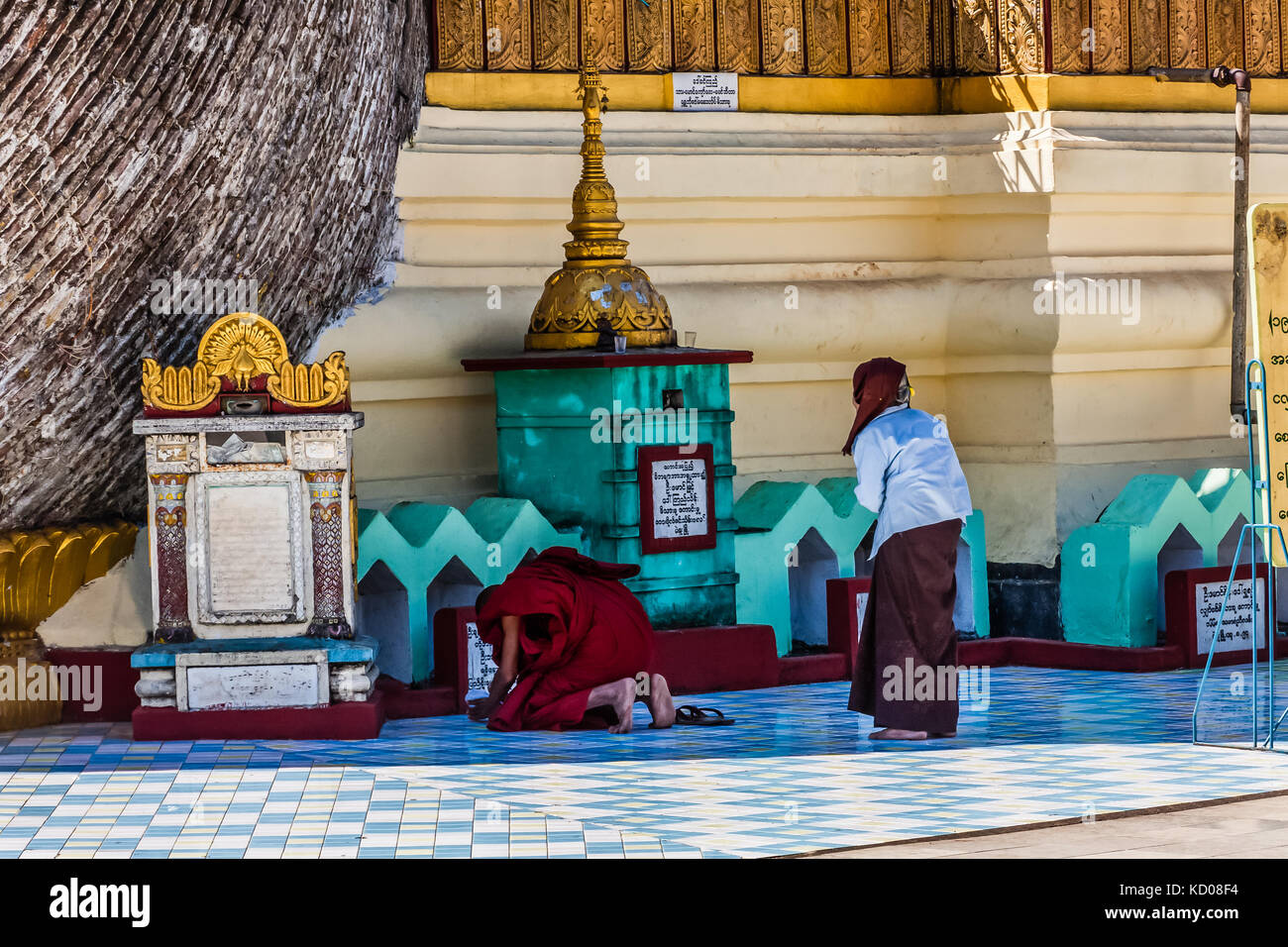 Praying people at the Old Hti of the Shwemawdaw Pagoda, Bago, Myanmar ...