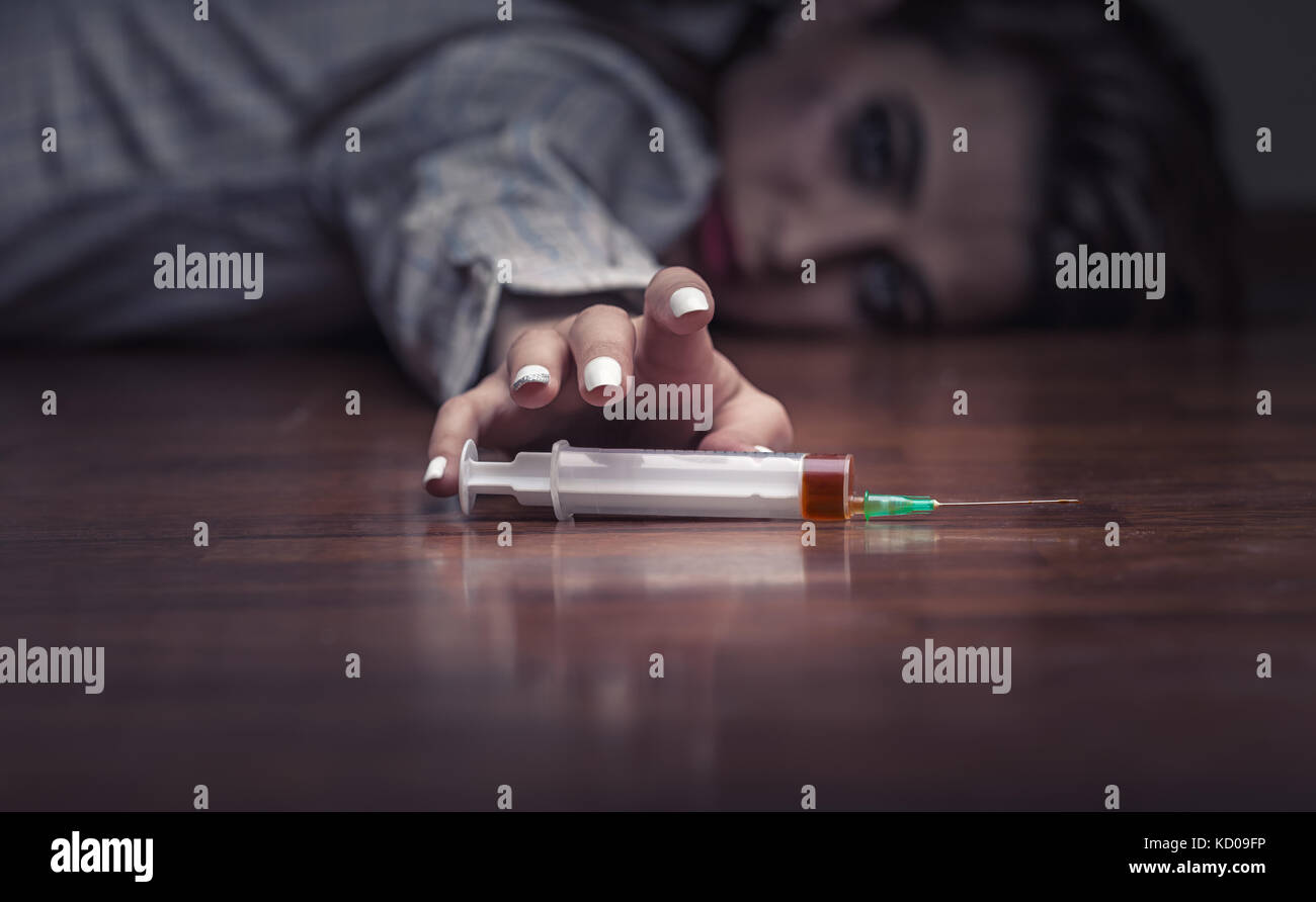 Close-up on the floor of the syringe with the drug. In the background ...