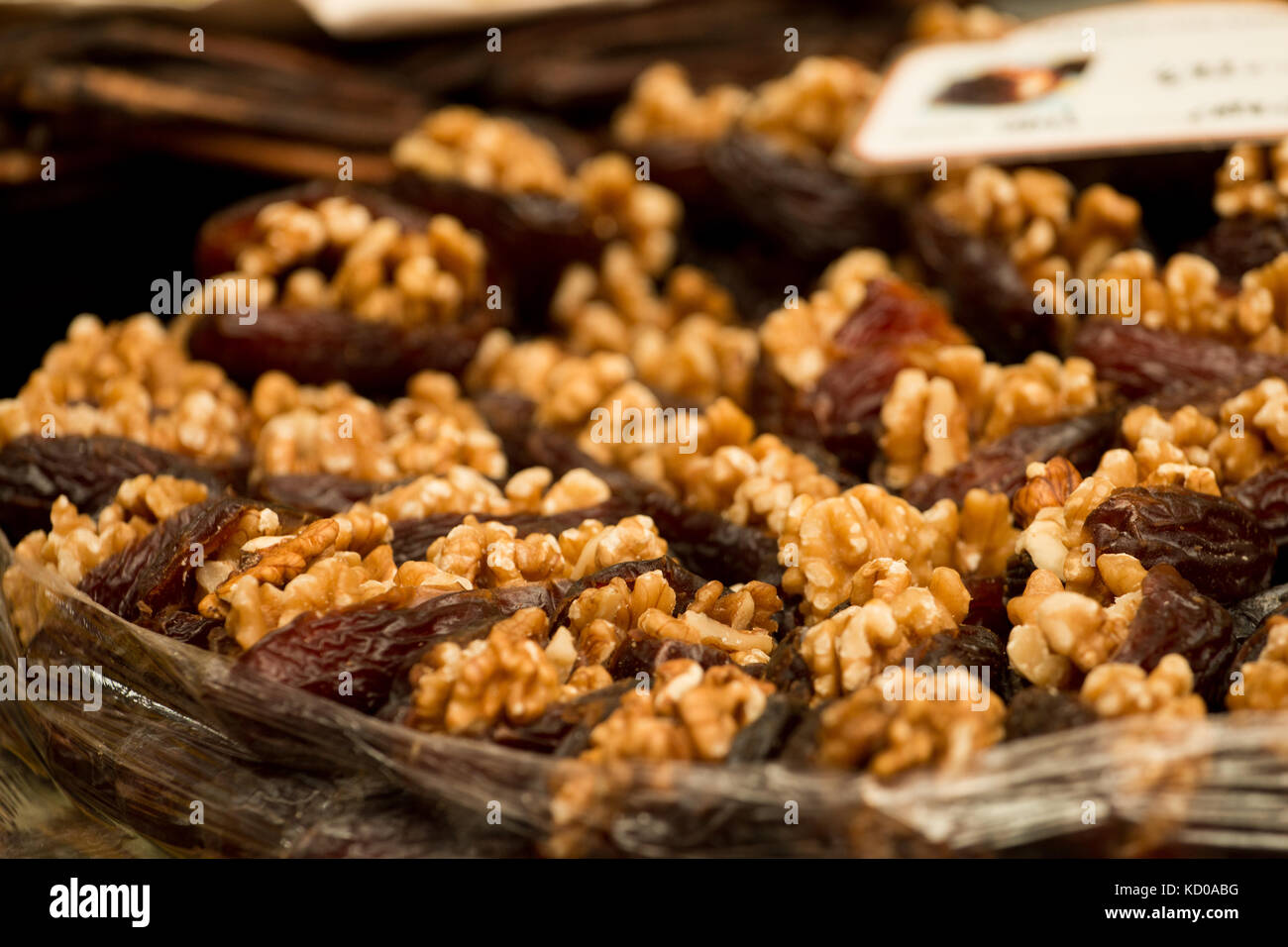 Date fruit with walnuts at sale on the market Stock Photo - Alamy