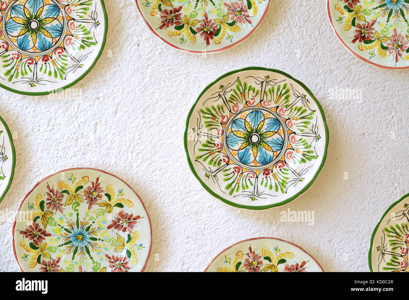 Some colored ceramic plates on a wall of a Patio in a Spanish city ...