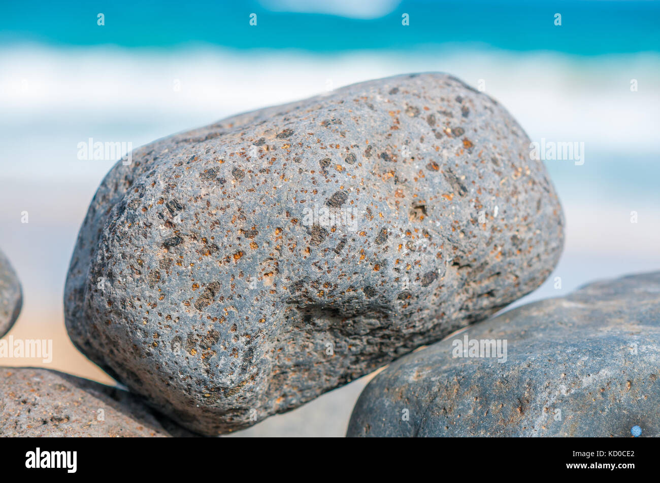Beach pebbles forming a wall with the beach in the background, Playa ...
