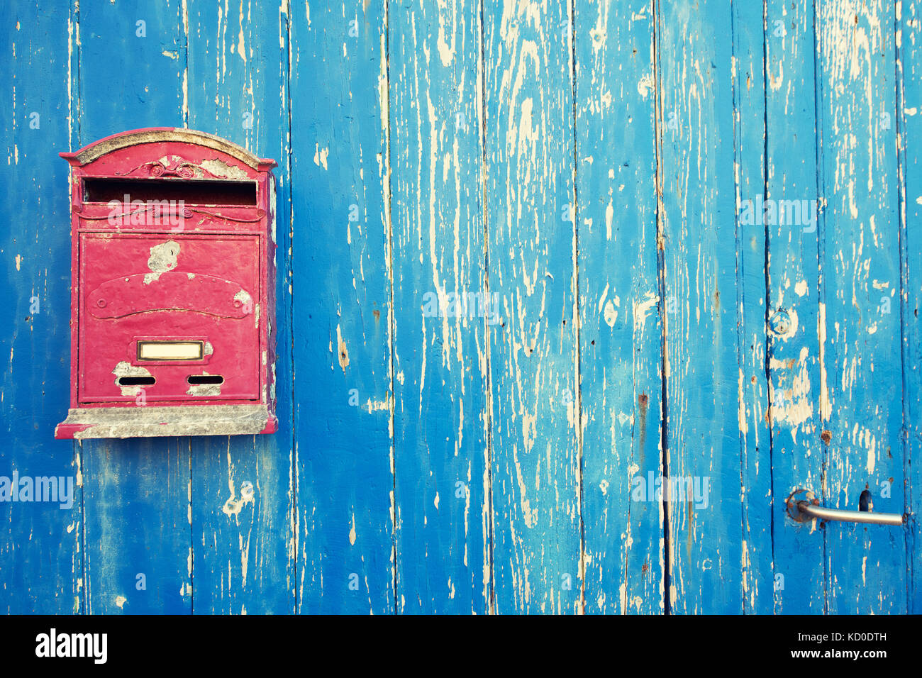 Blue door with a red letterbox Stock Photo - Alamy