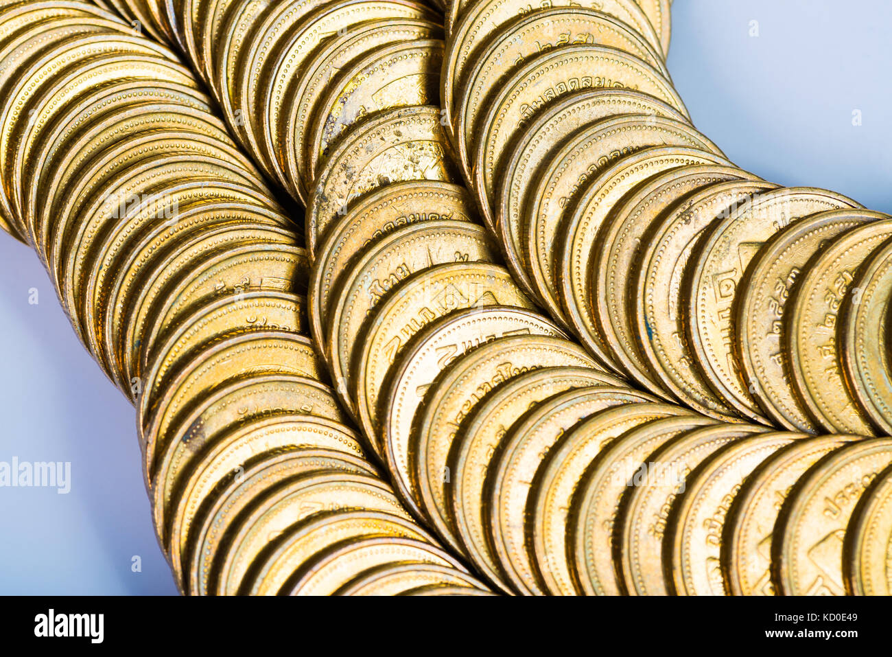 Columns of gold coins, piles of coins arranged on white background ...