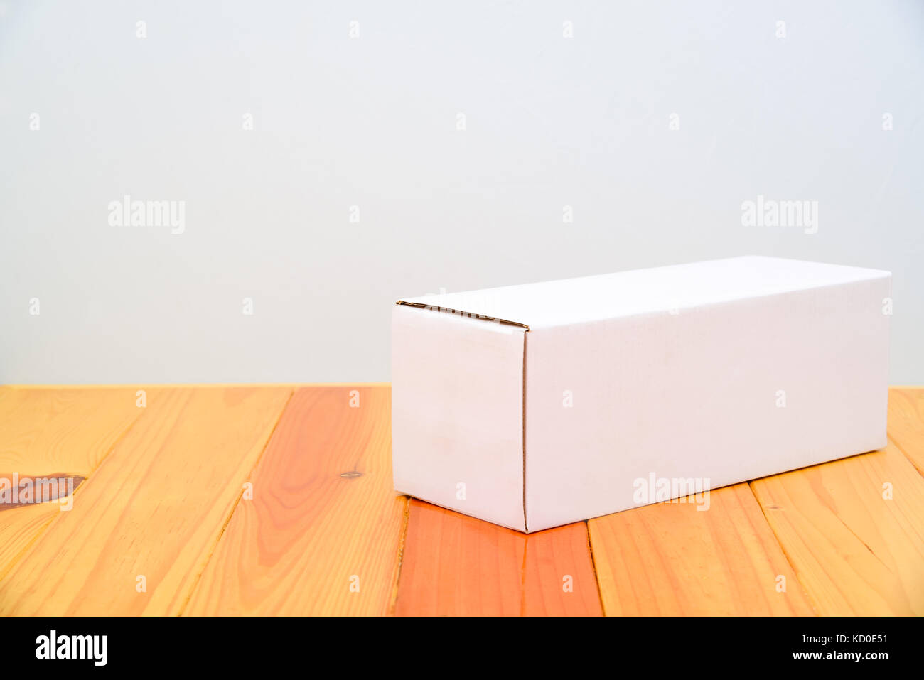 Empty Package white cardboard box mock up for long items on bright ...
