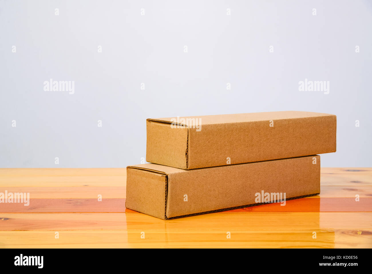 Empty two Package brown cardboard box mock up for long items on bright ...