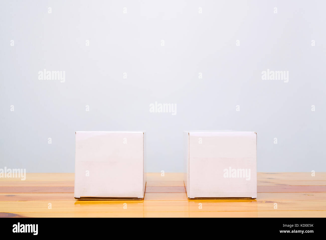 Empty four Package white cardboard box mock up for long items on bright ...