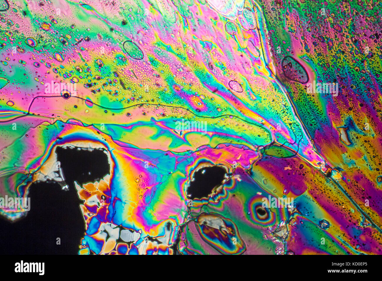 colorful microscopic shot of Sodium acetate micro crystals in polarized ...