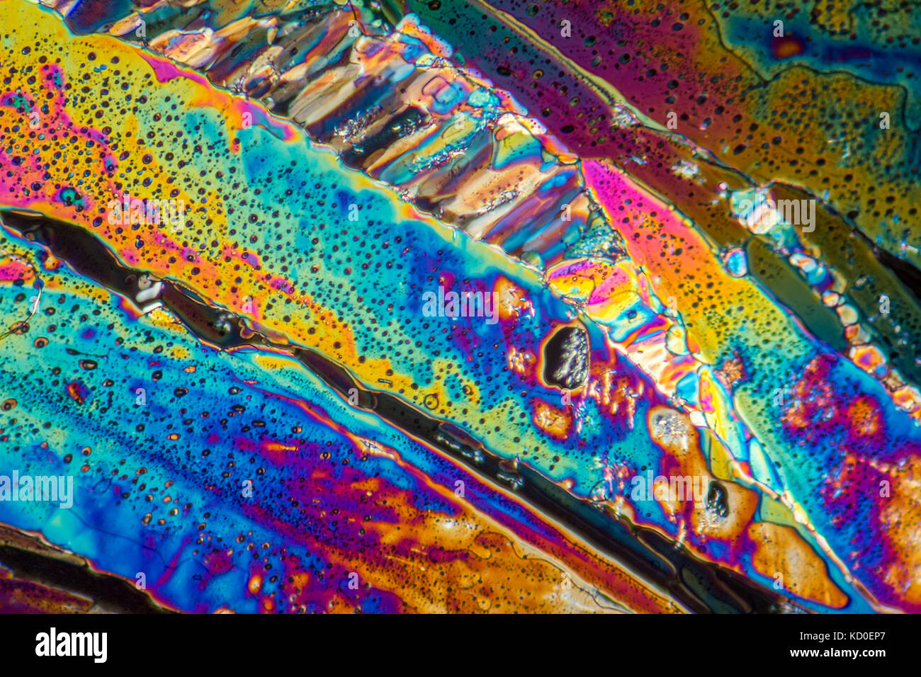 colorful microscopic shot of Sodium acetate micro crystals in polarized ...