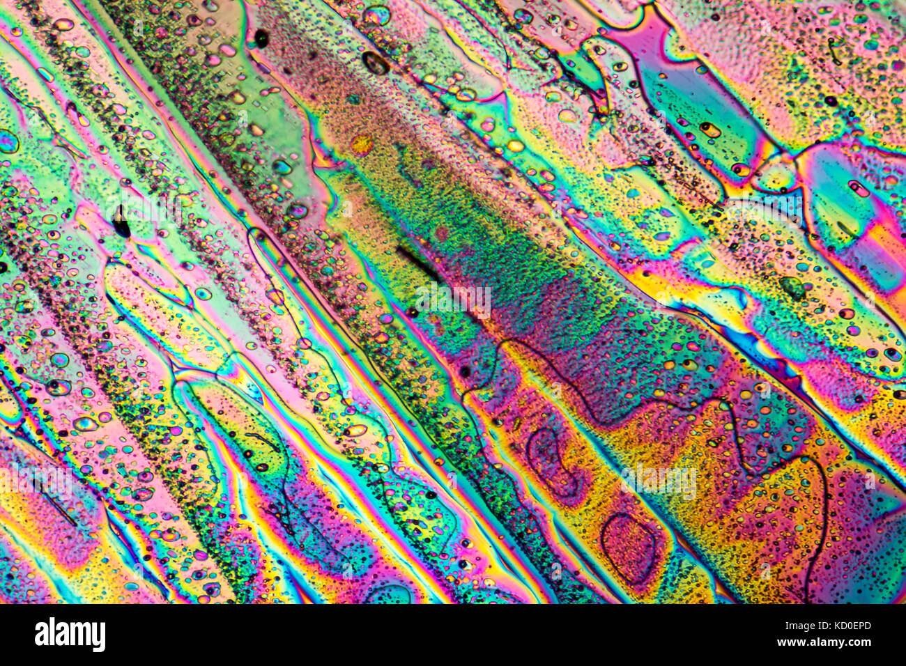 colorful microscopic shot of Sodium acetate micro crystals in polarized ...