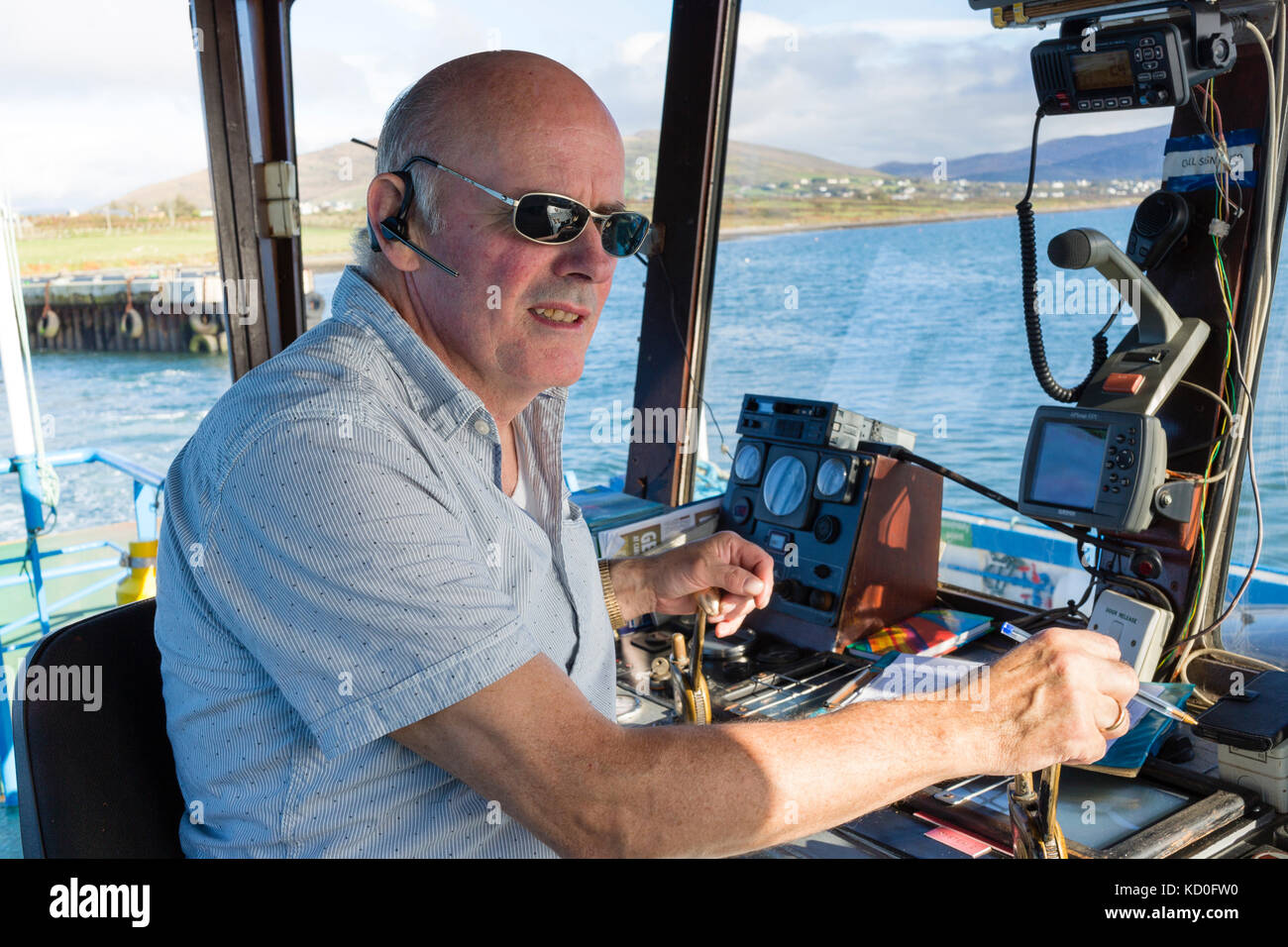 Valentia Island Car Ferry captain at the helm Stock Photo - Alamy