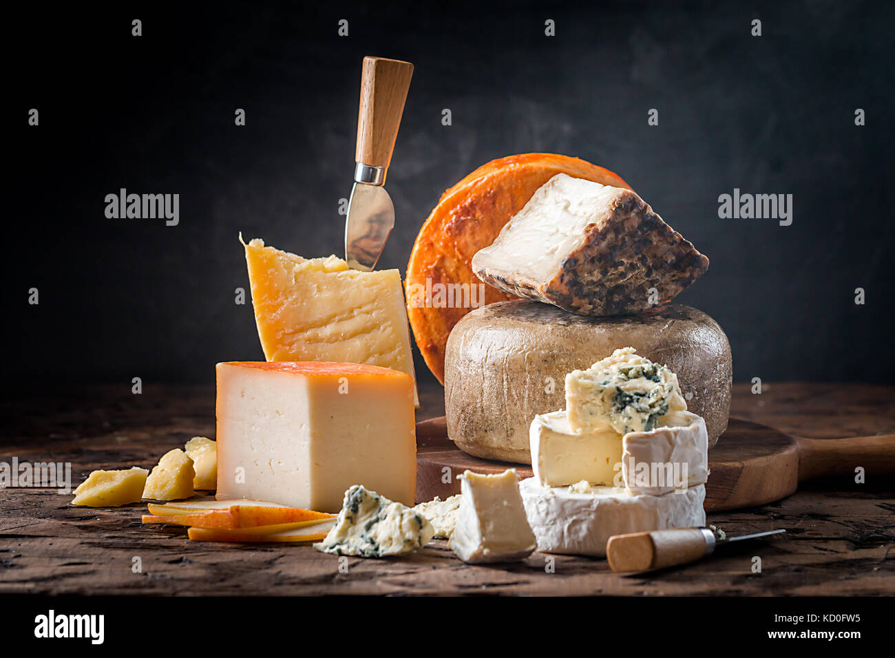 various types of cheese on rustic wooden table Stock Photo - Alamy
