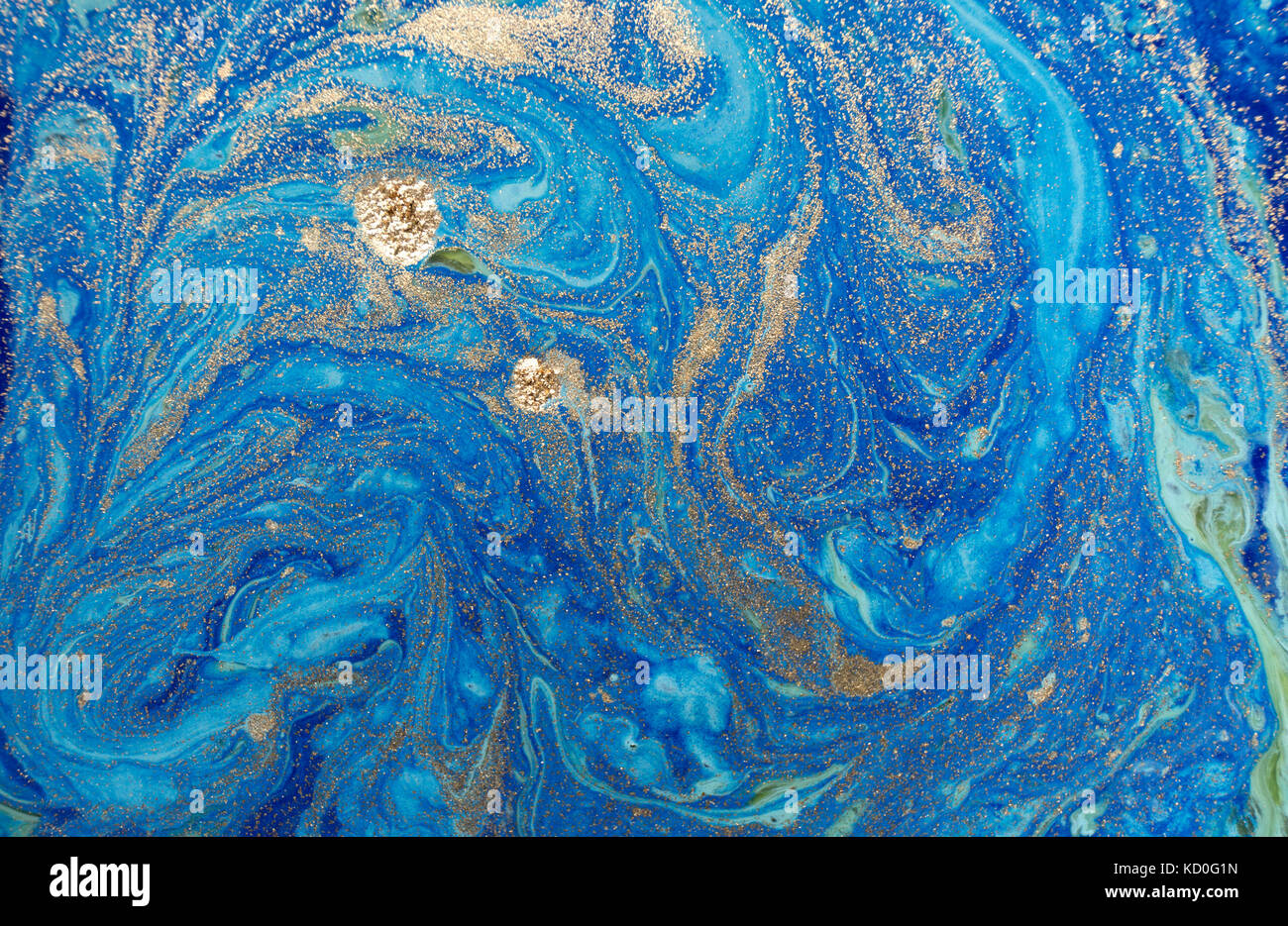 Marbled blue abstract background with golden sequins. Liquid marble ink ...