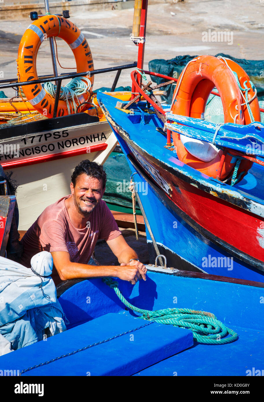 Seaman on the harbour Stock Photo - Alamy