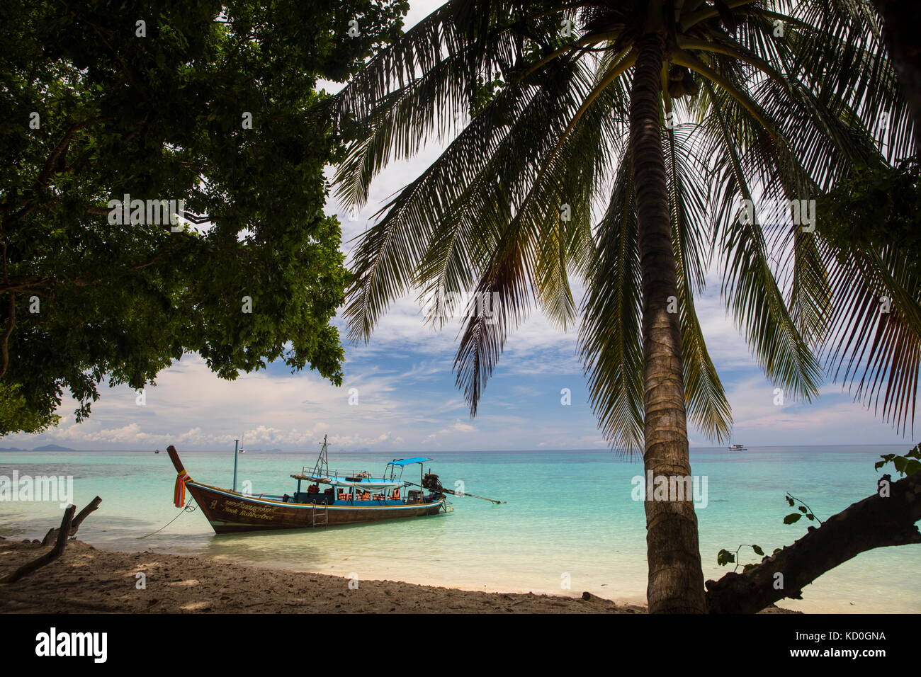 Longtail boat moored by beach, Koh Rok Noi, Thailand, Asia Stock Photo ...