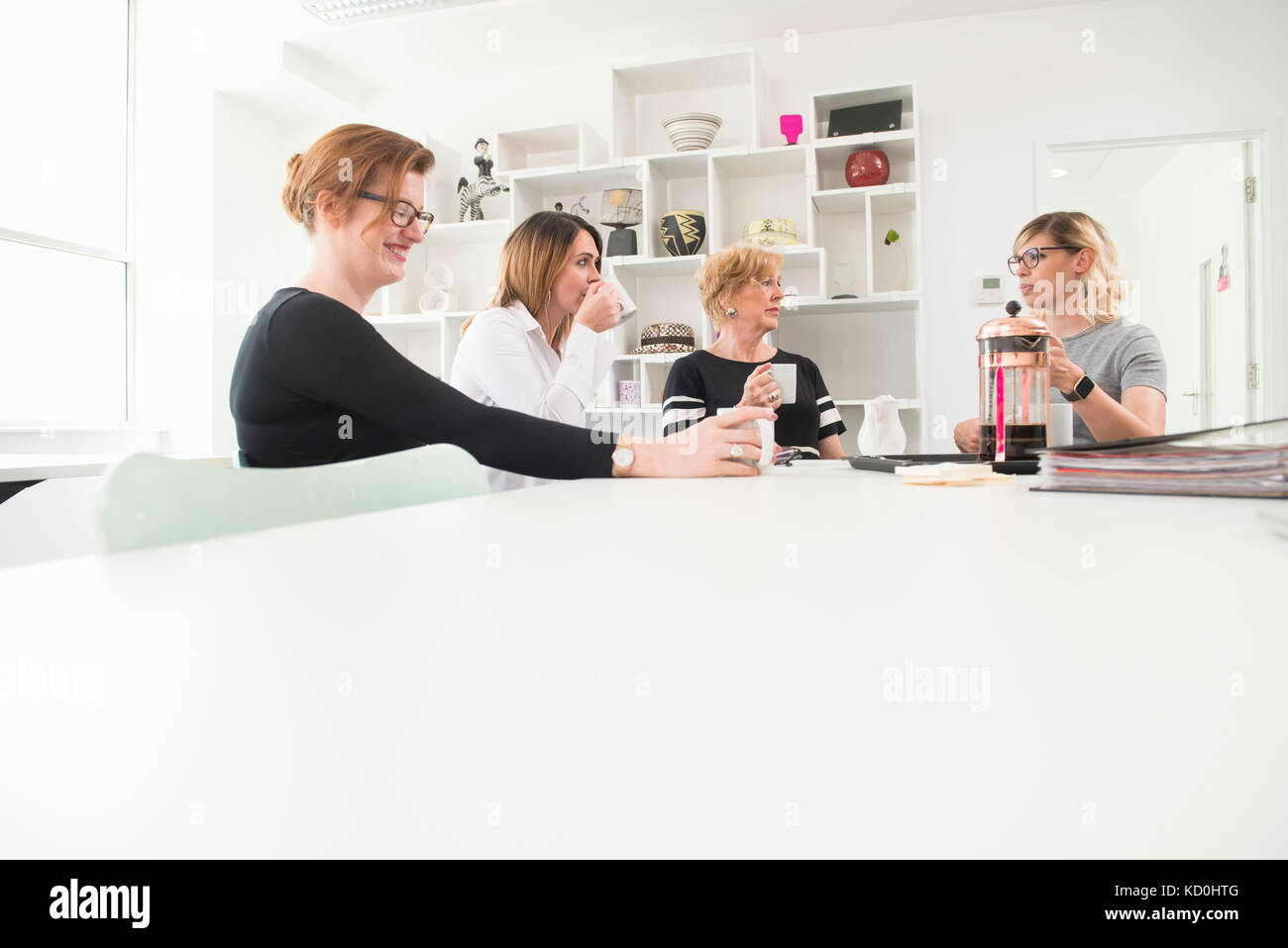 Women having coffee break in office Stock Photo - Alamy