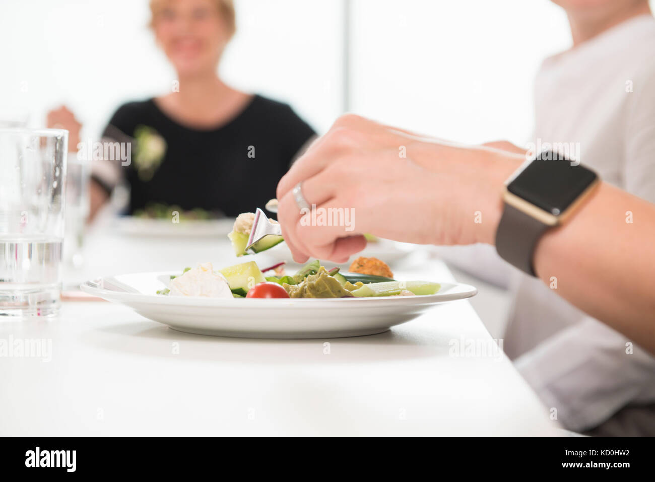 Businesswomen at working lunch in office Stock Photo - Alamy