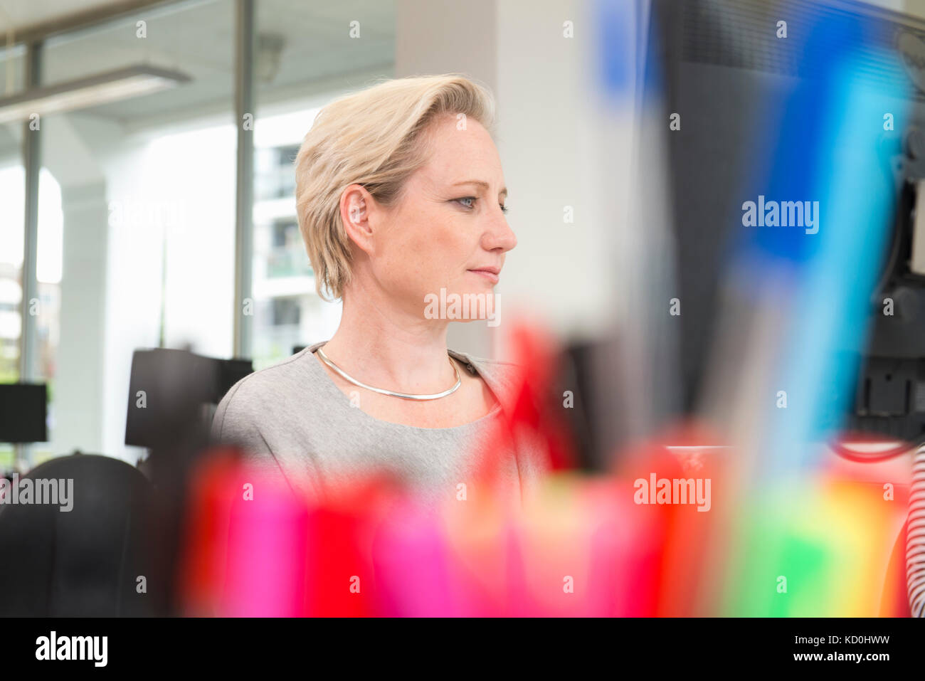 Woman working at computer Stock Photo - Alamy