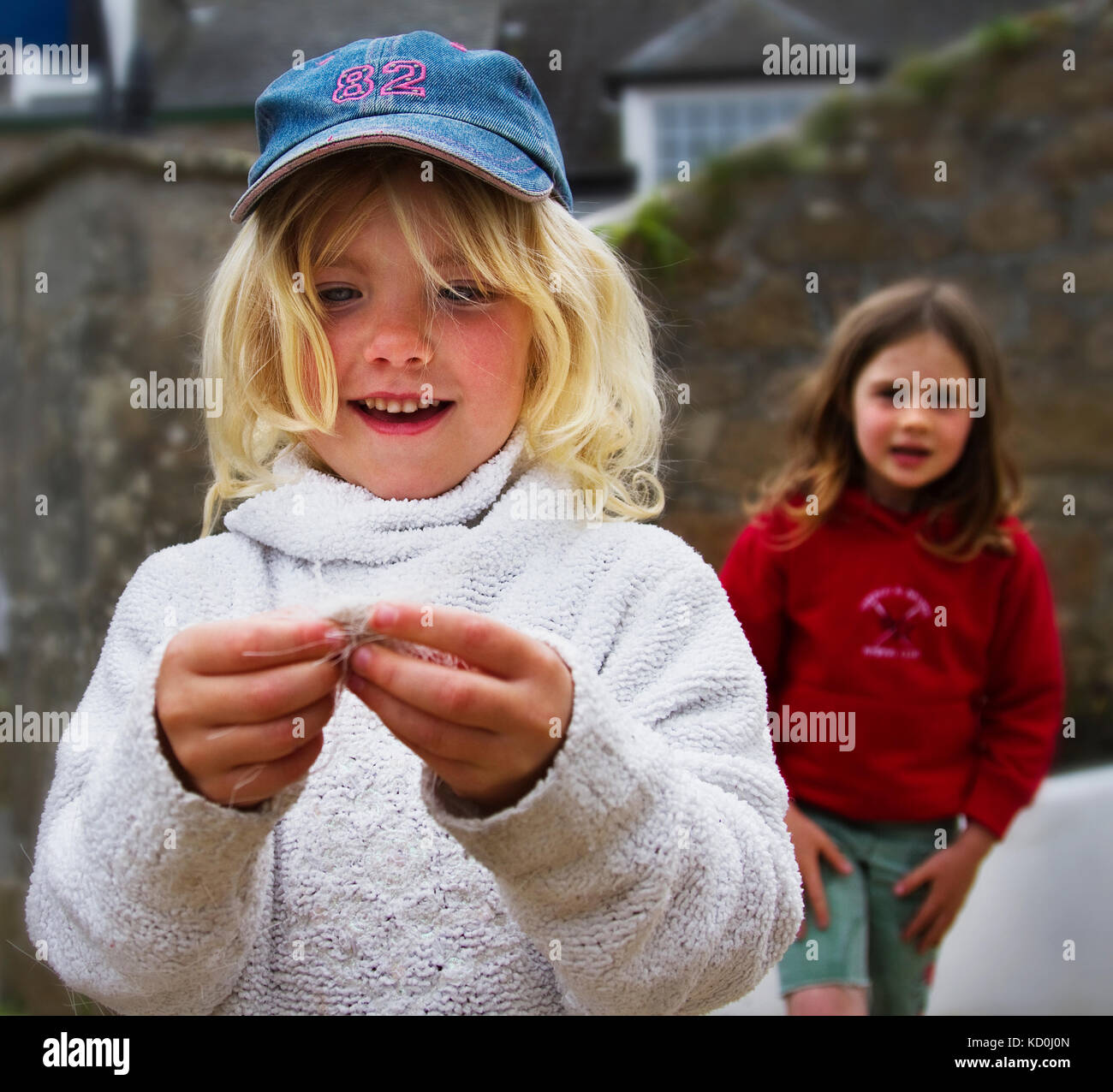 Girls playing outdoors Stock Photo - Alamy