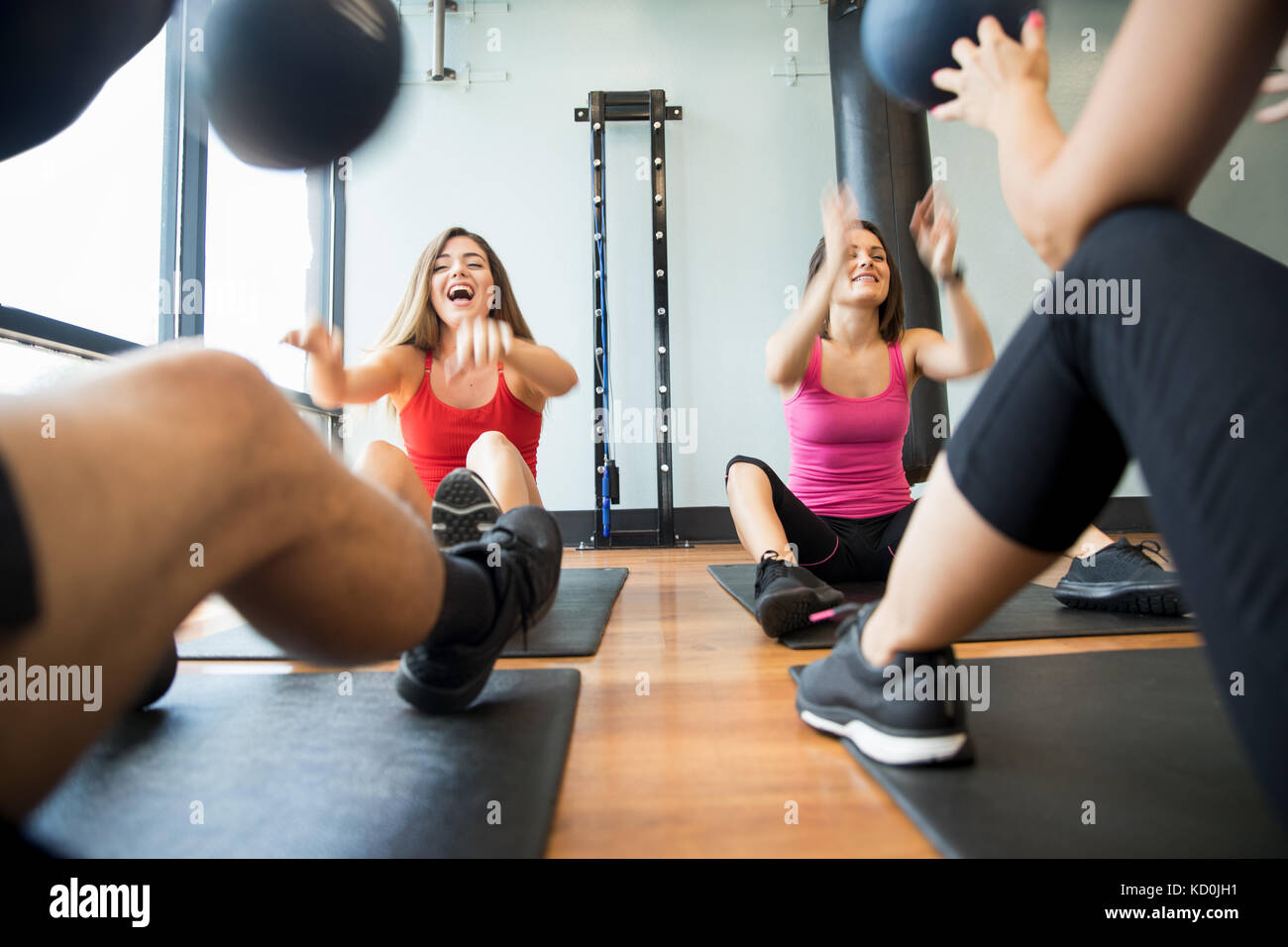 Friends training with medicine ball in gym Stock Photo - Alamy