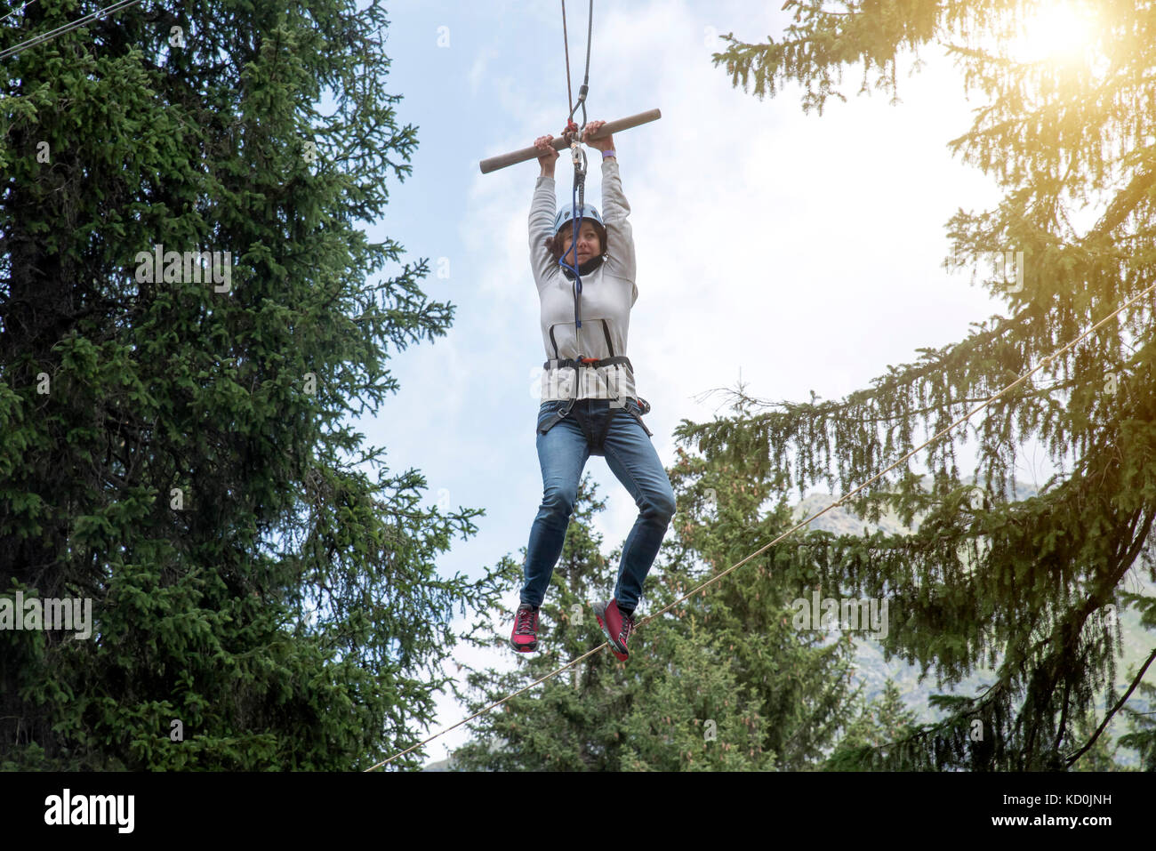 Woman zip line hi-res stock photography and images - Alamy